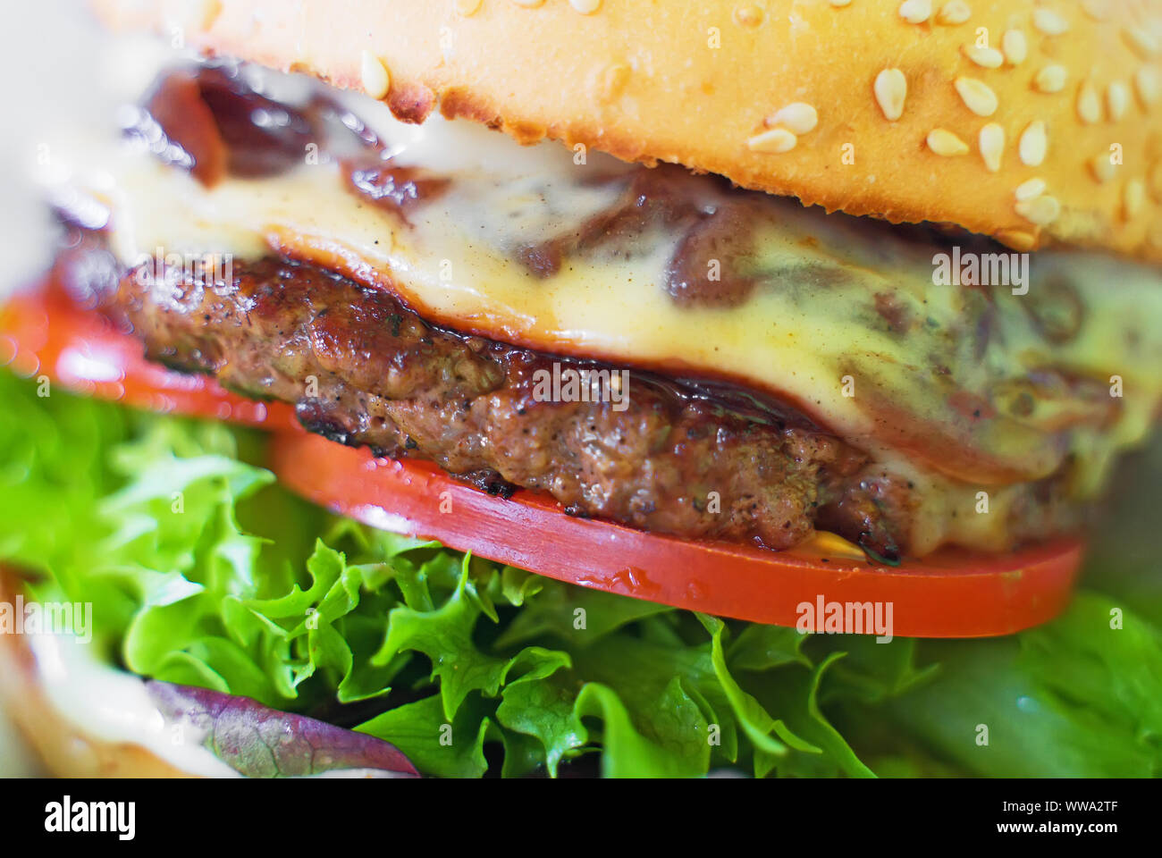 Fast food. A juicy freshly cooked burger Stock Photo - Alamy