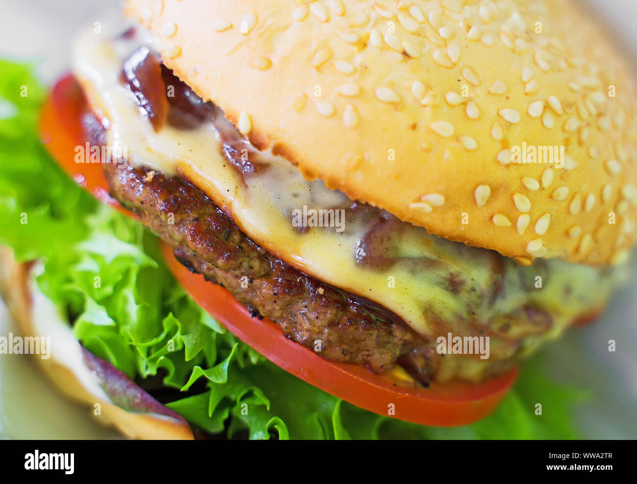 Fast food. A juicy freshly cooked burger Stock Photo - Alamy