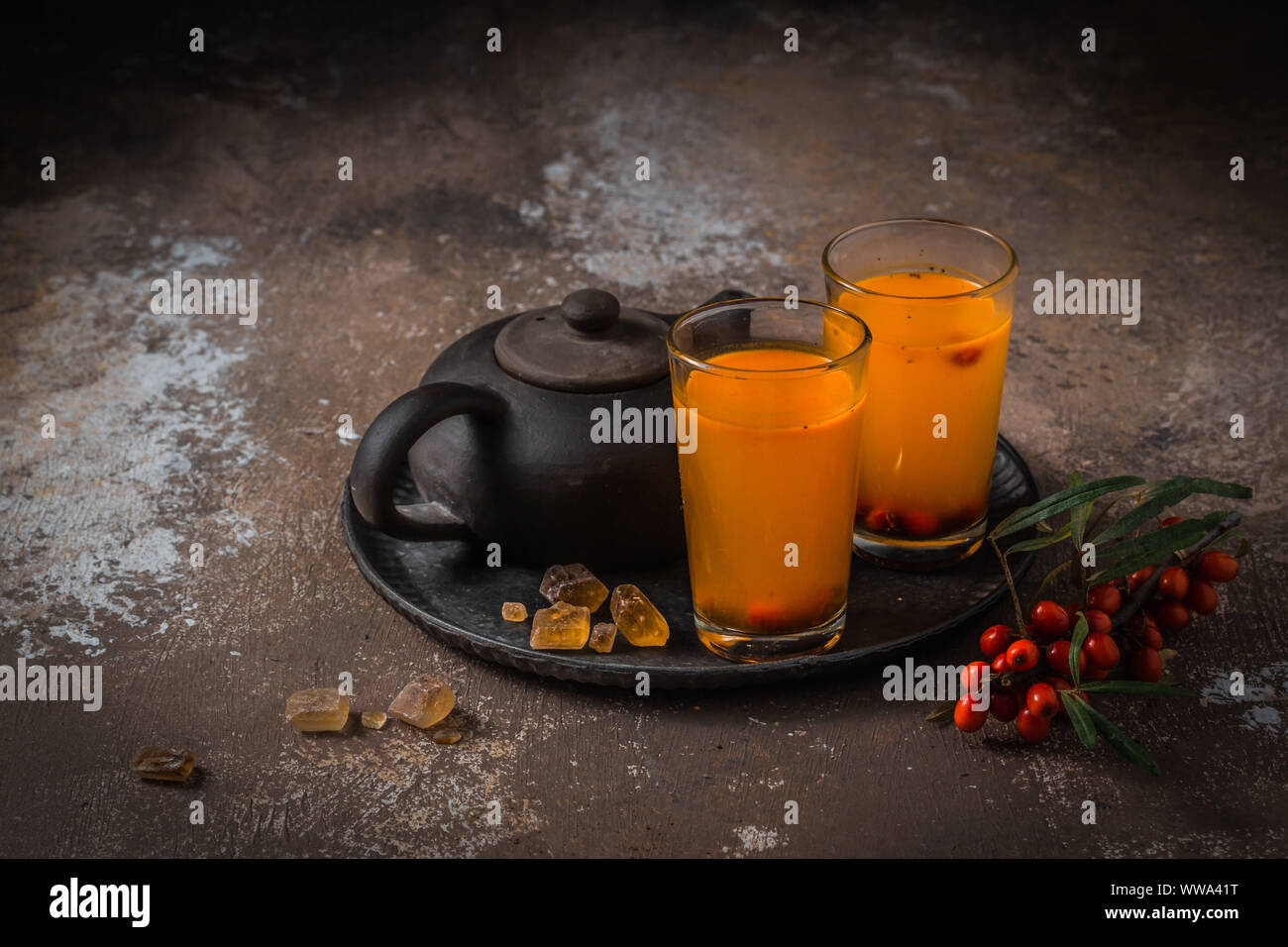 Berry tea with teapot, dark photo, cope space Stock Photo - Alamy