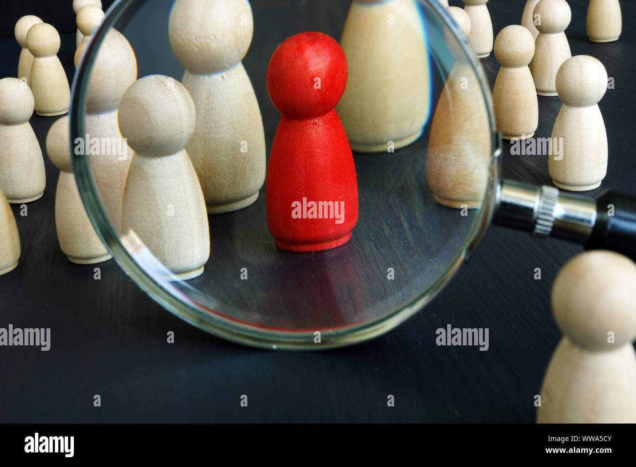 Recruitment Sourcing and strategies concept. Magnifying glass and red ...