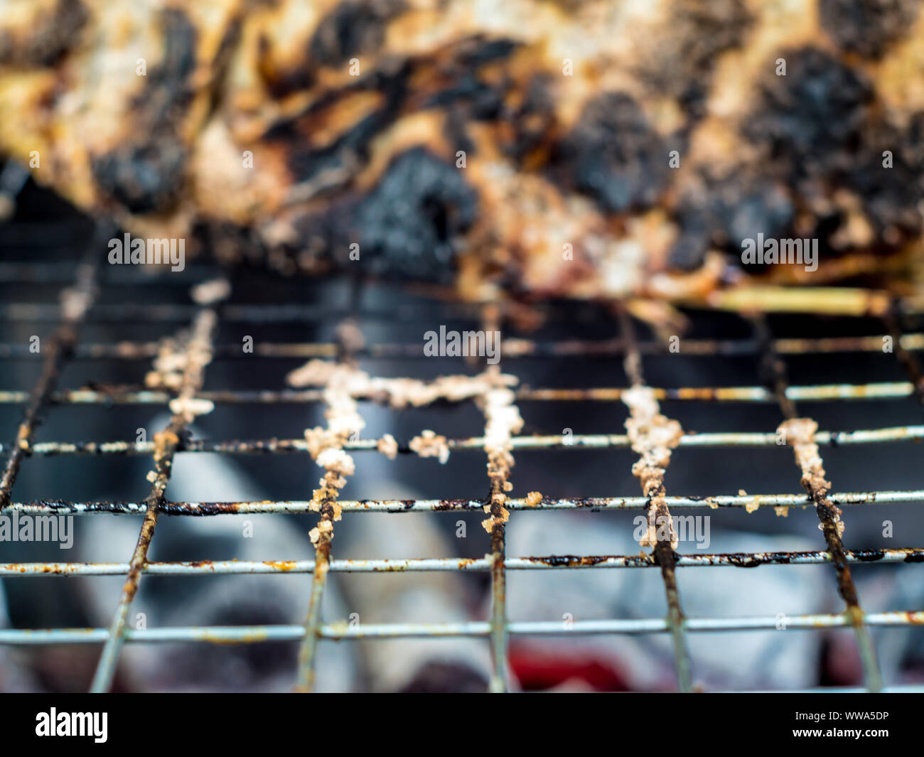 Skin of fish grilled on hot charcoal until black and scorched Stock ...