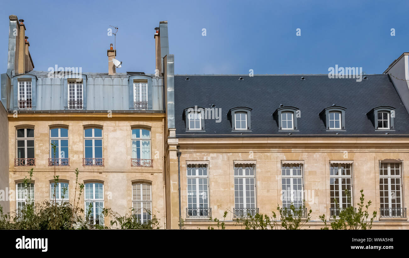 Paris, charming street and buildings, typical parisian facades in the ...