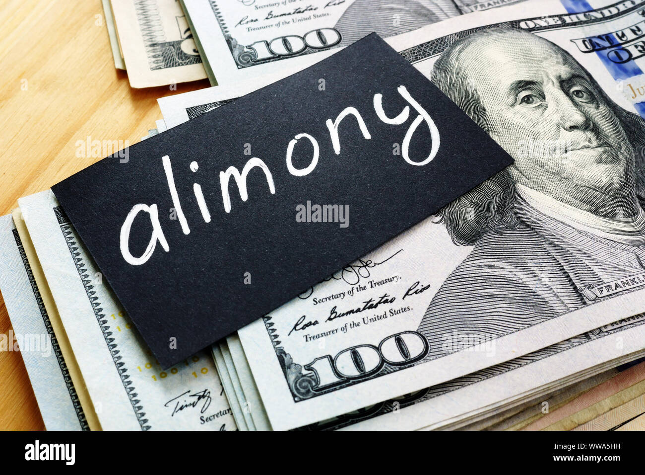 Alimony sign on a black piece of paper and money Stock Photo - Alamy