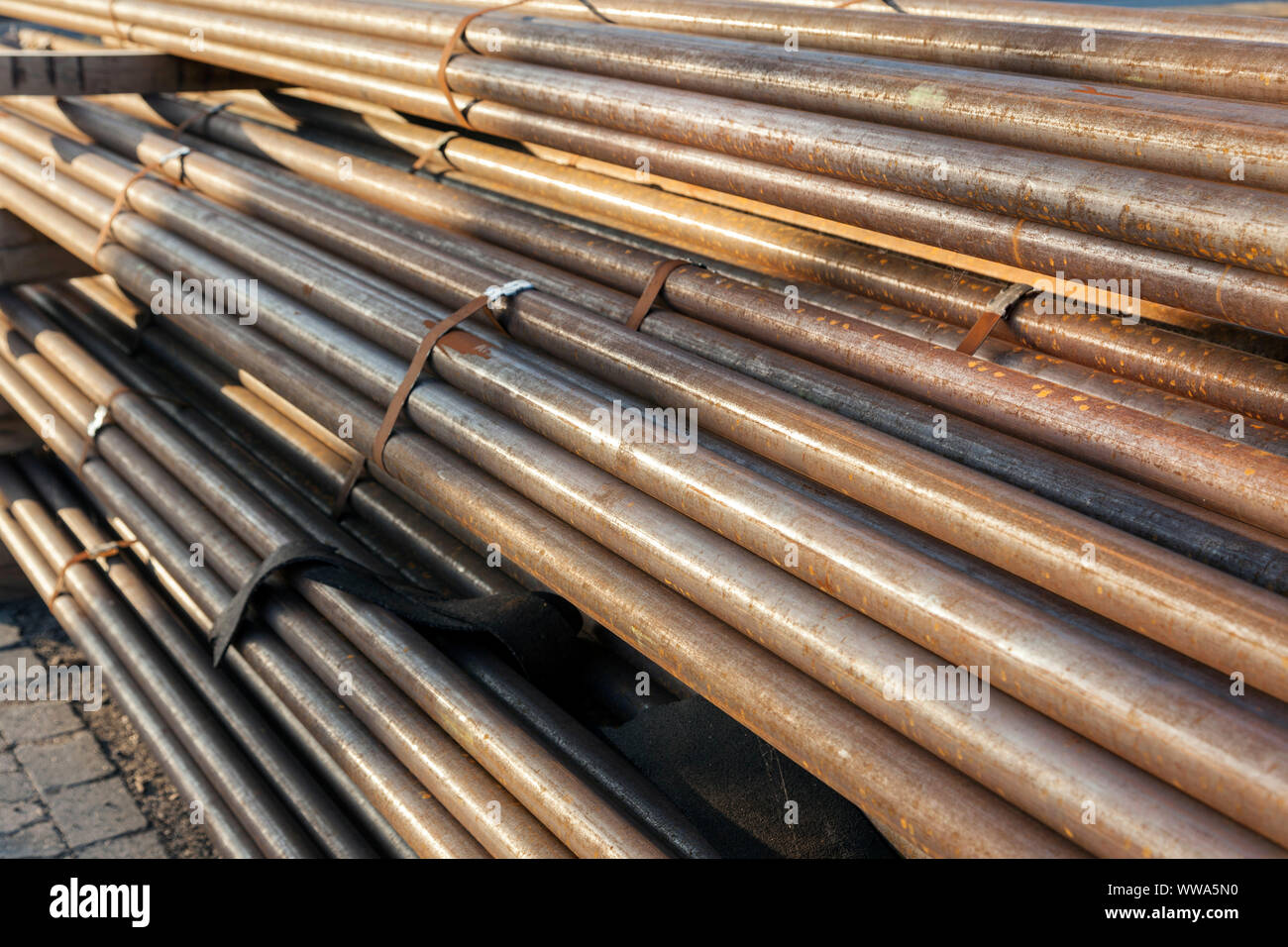 Round steel in a steel warehouse Stock Photo - Alamy