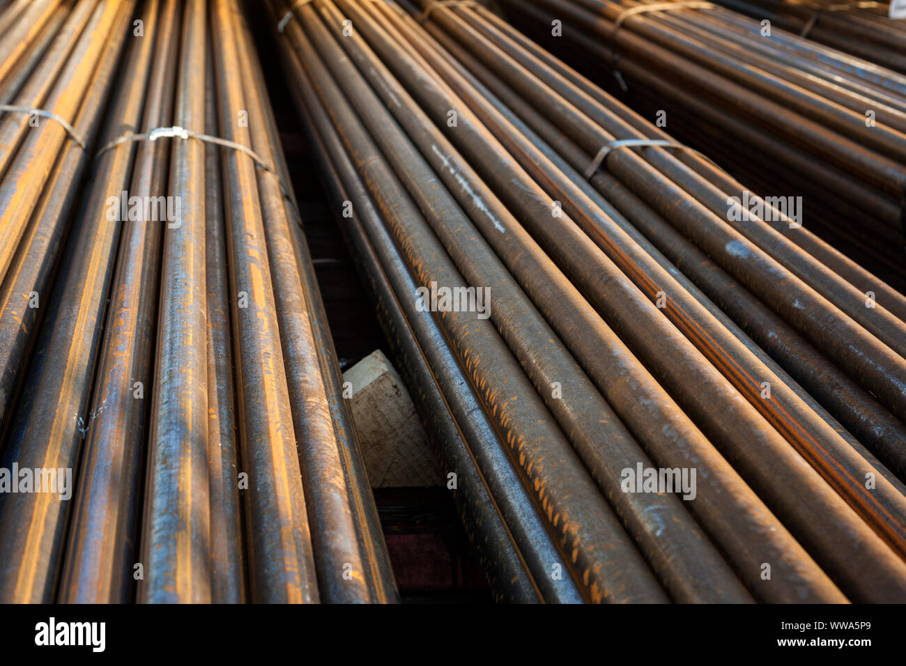 Round steel in a steel warehouse Stock Photo - Alamy