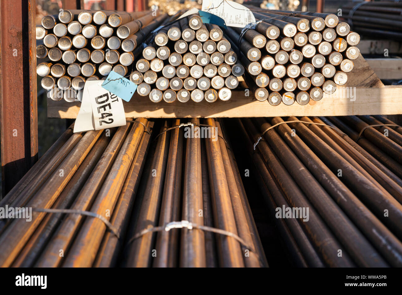 Round steel in a steel warehouse Stock Photo - Alamy
