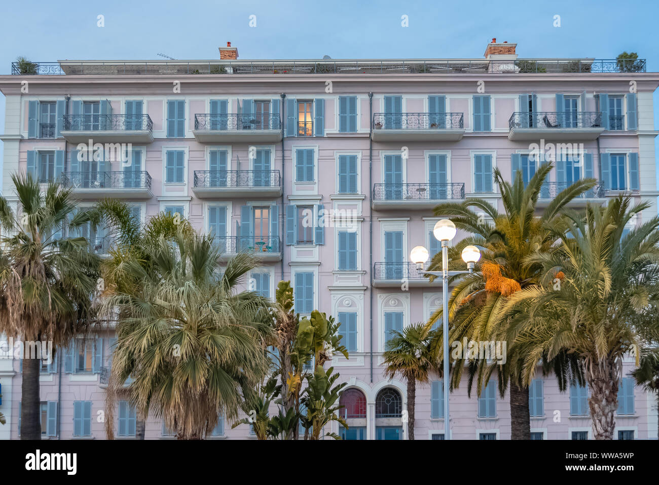 Nice, France, colorful facade, with typical windows and shutters, in a ...