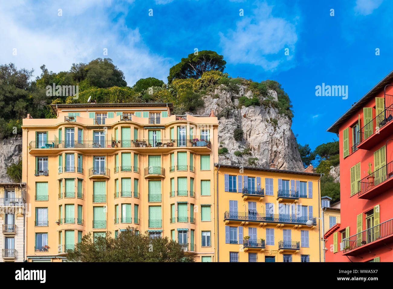 Nice, France, colorful facade, with typical windows and shutters, in a ...
