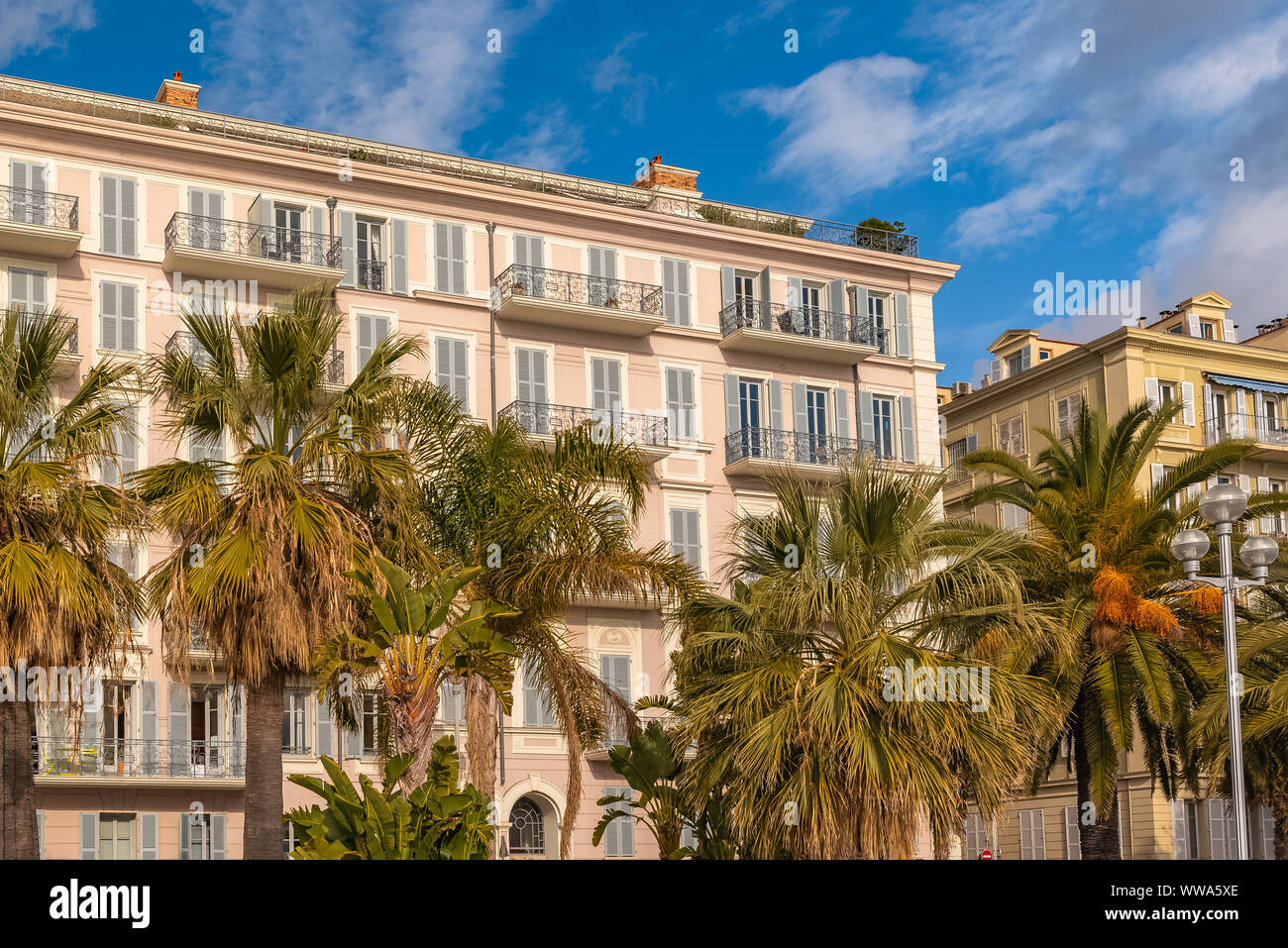 Nice, France, colorful facade, with typical windows and shutters, in a ...