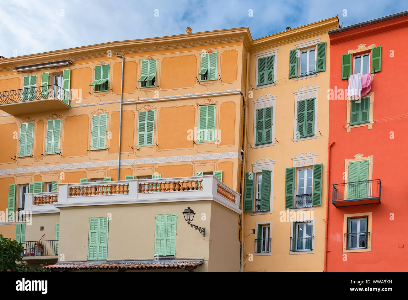 Nice, France, colorful facade, with typical windows and shutters, in a ...
