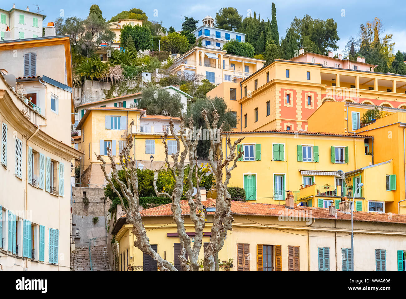 Nice, France, colorful facade, with typical windows and shutters, in a ...