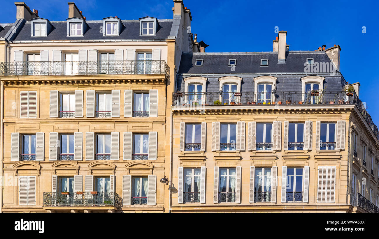Paris, charming street and buildings, typical parisian facades in the ...