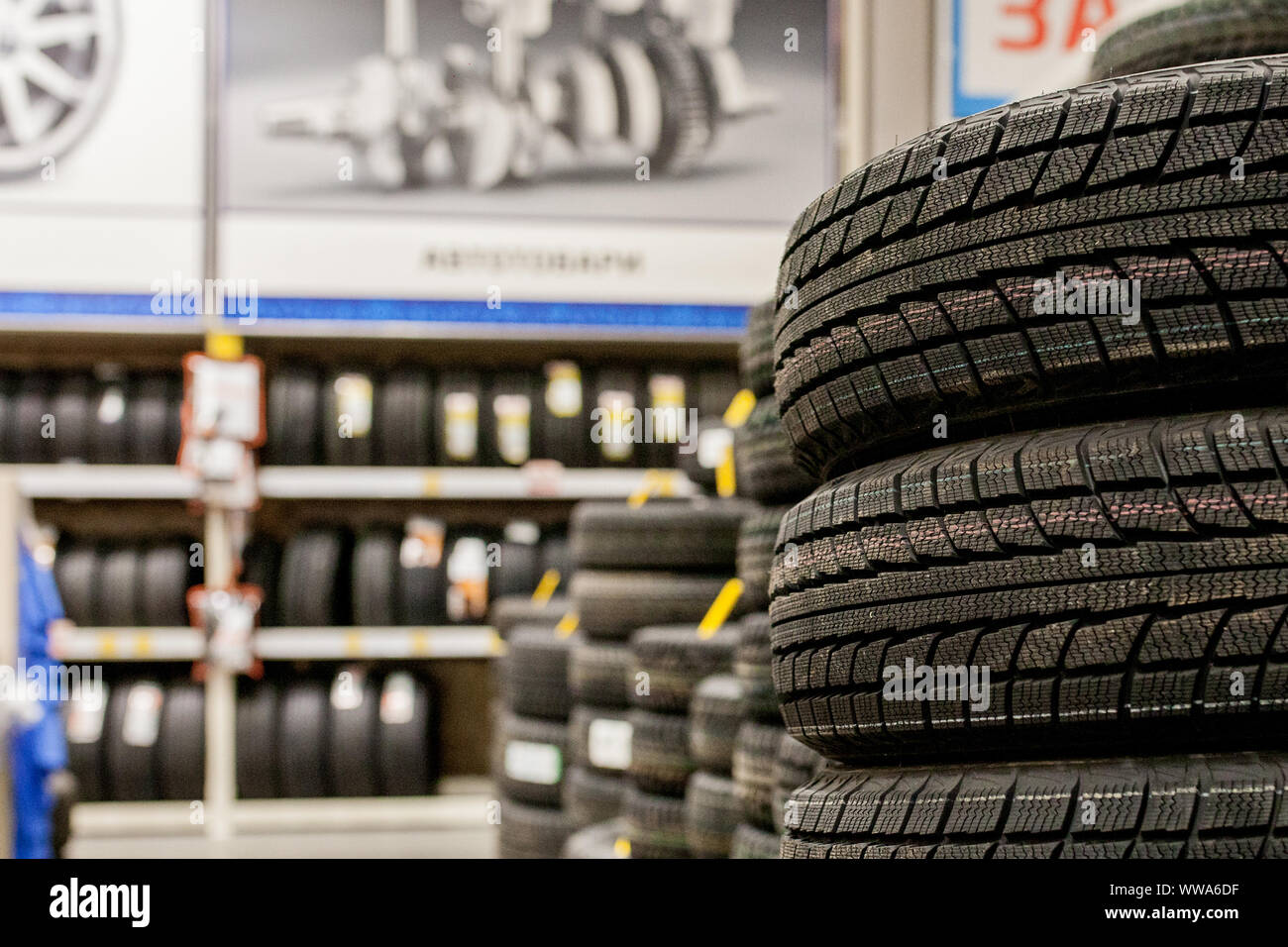 Car tires and wheels at warehouse in tire store Stock Photo - Alamy