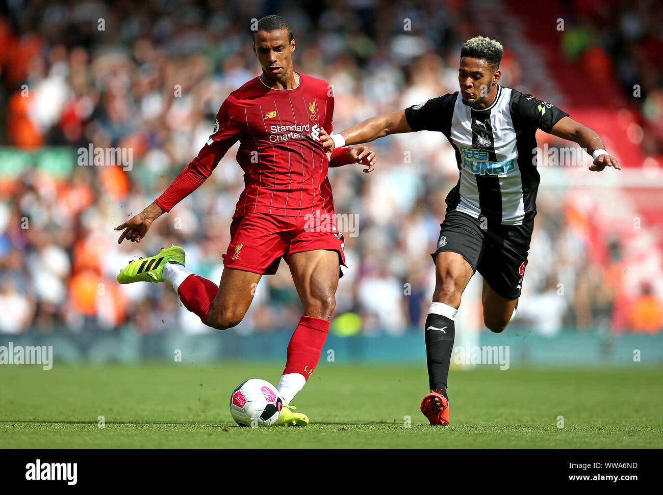 Liverpool's Joel Matip (left) and Newcastle United's Joelinton during ...
