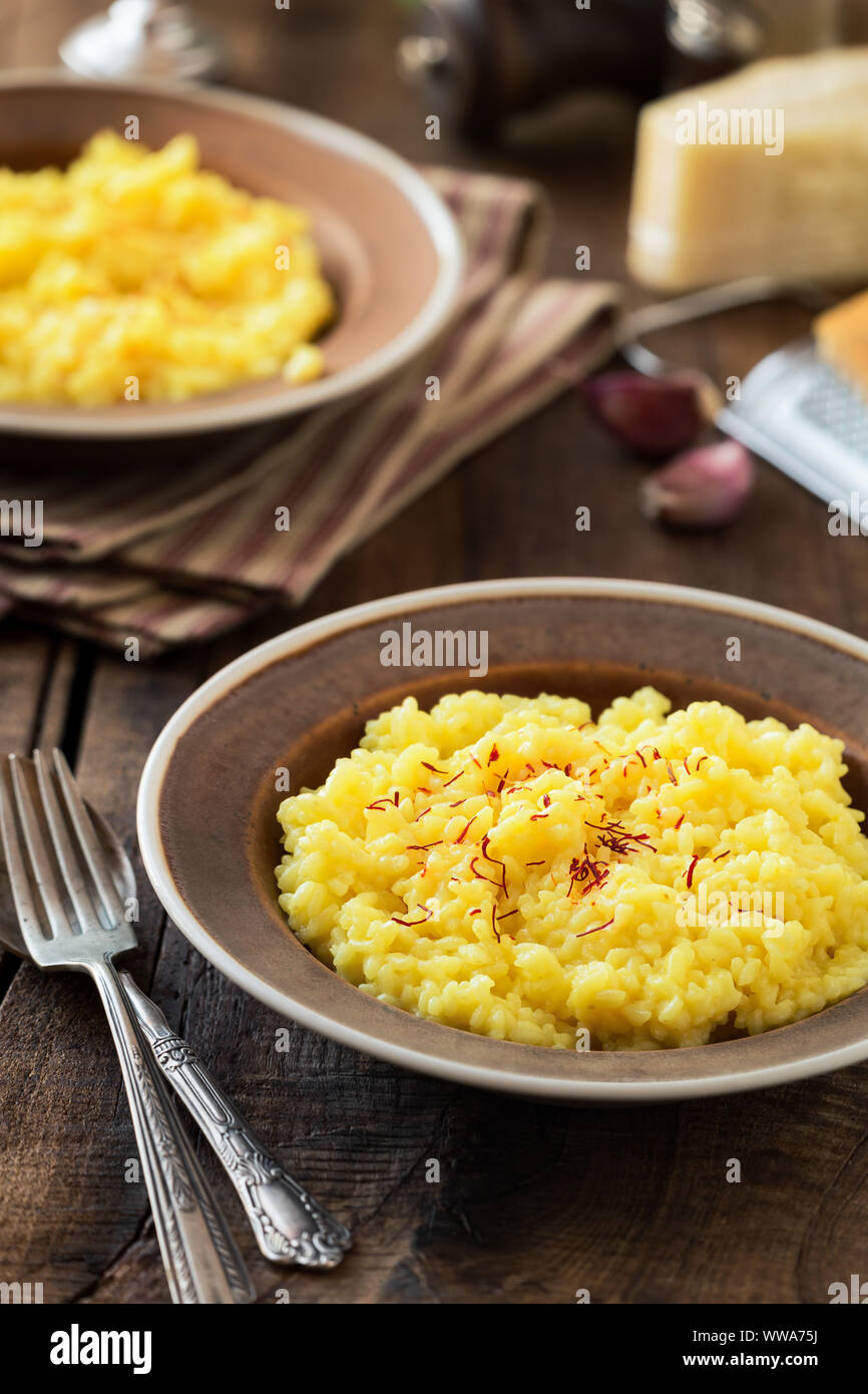 Italian saffron risotto alla milanese served for two Stock Photo - Alamy