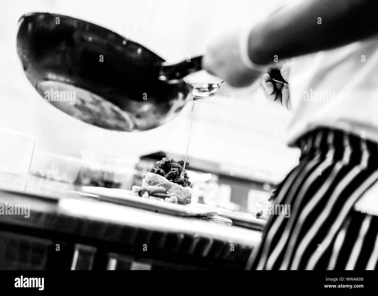 chef preparing food, chef cooking in a kitchen, chef at work, Black ...