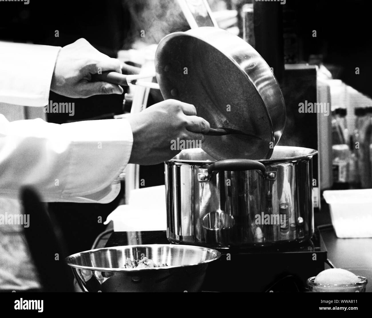 chef preparing food, chef cooking in a kitchen, chef at work, Black ...