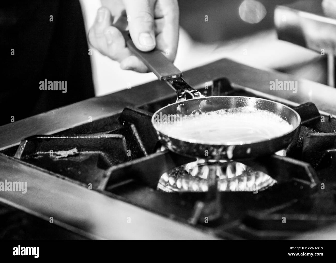 chef preparing food, chef cooking in a kitchen, chef at work, Black ...