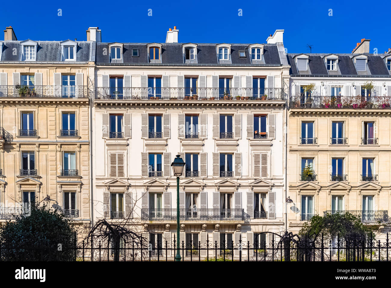Paris, charming street and buildings, typical parisian facades in the ...