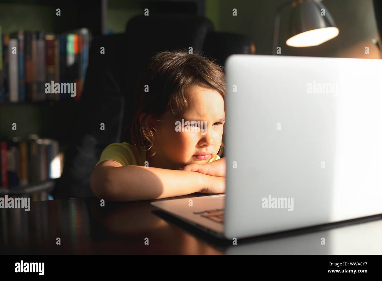 Cute baby girl working on a computer at home Stock Photo - Alamy