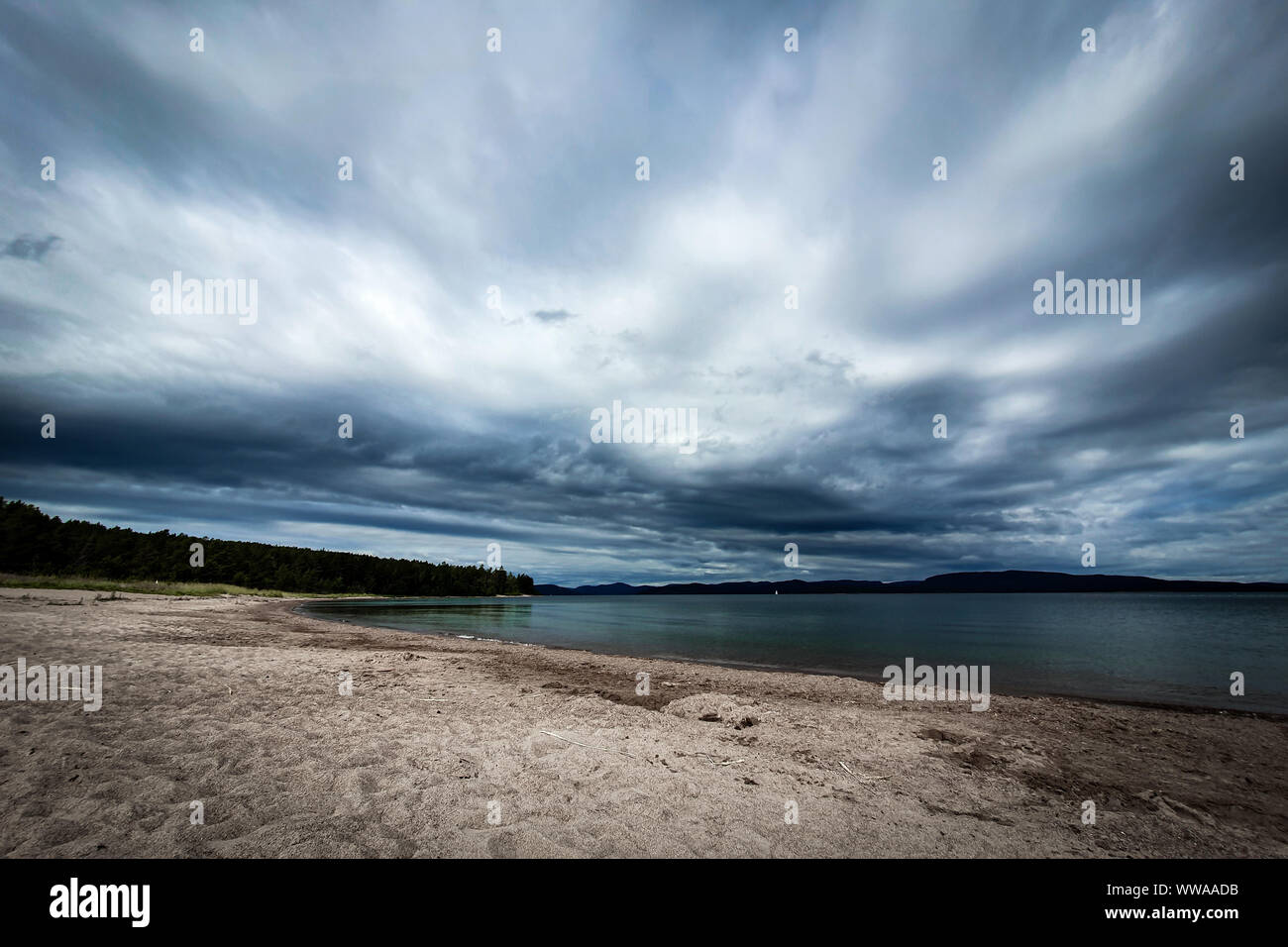 Dramatic sky over beautiful sandy beach and archipelago in Gulf of ...