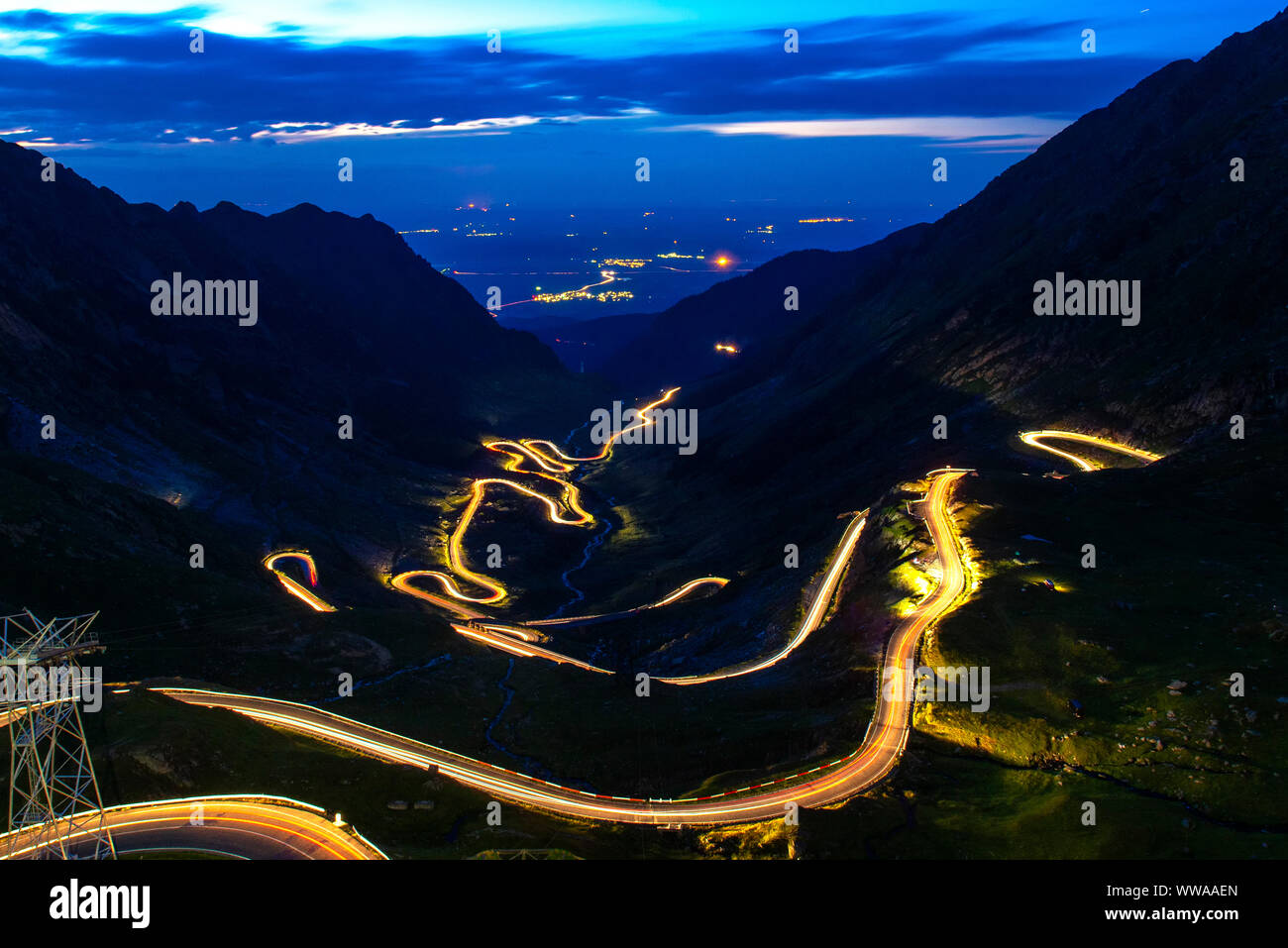 Traffic trails on Transfagarasan pass at night. Crossing Carpathian ...