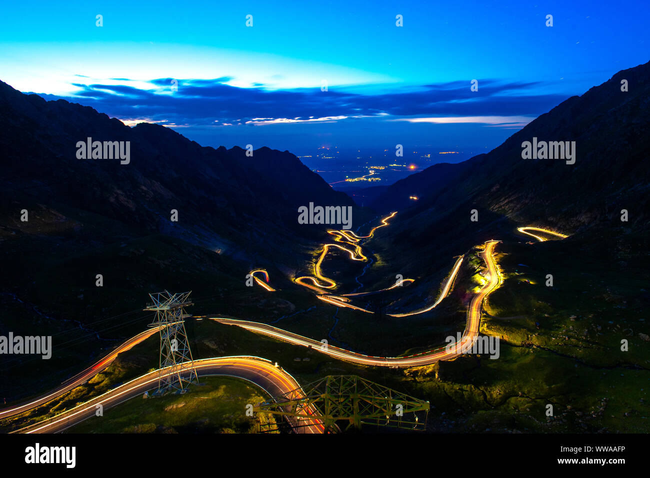 Traffic trails on Transfagarasan pass at night. Crossing Carpathian ...