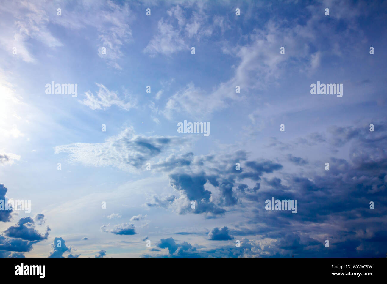 The rays of the sun break through the storm clouds, cumulus cloudscape Stock Photo - Alamy