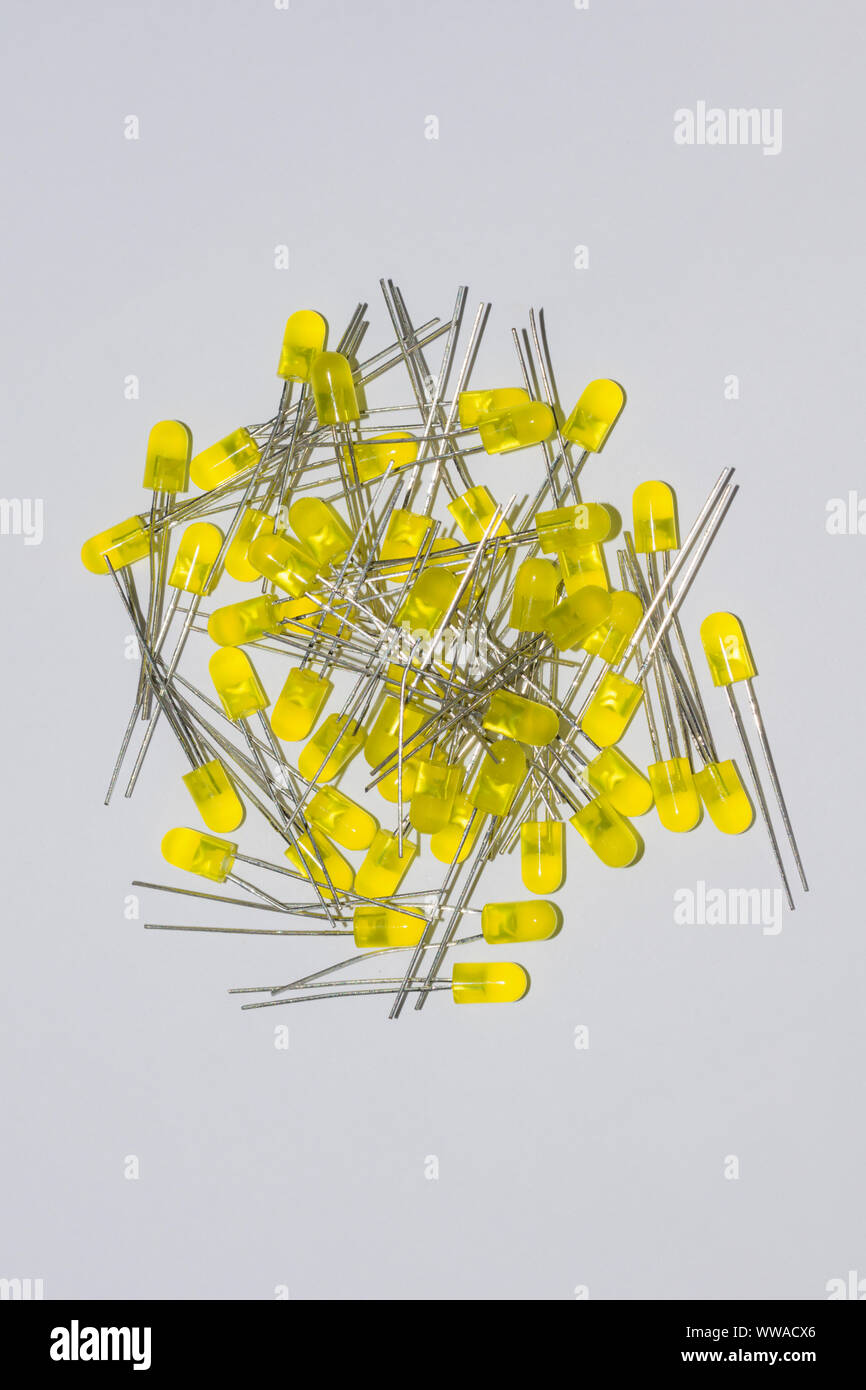 close up image of 5mm yellow leds isolated on white background,pile of ...
