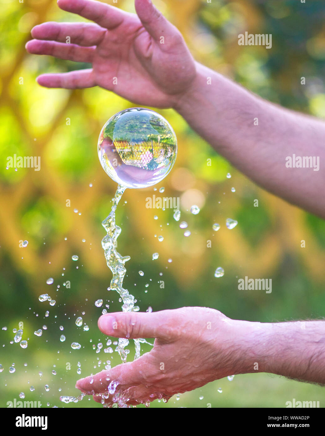 throwing a glass ball into the air Stock Photo - Alamy