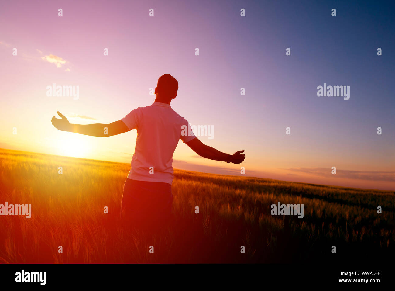 Silhouette man raised hands in hi-res stock photography and images - Alamy