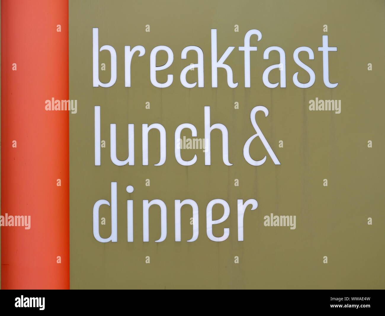 Breakfast Lunch and Dinner sign white letters with Orange side stripe ...