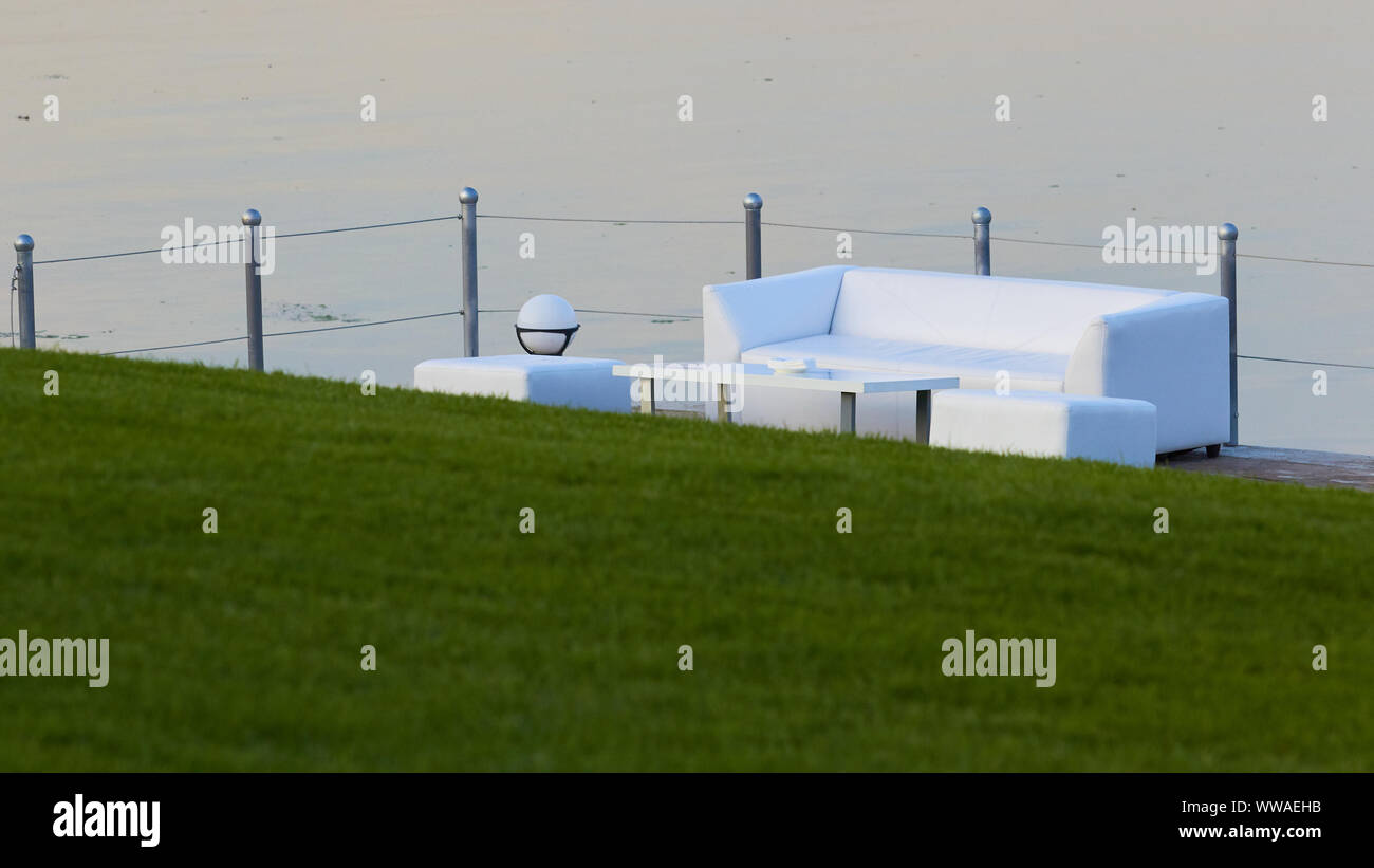 Lounge area for guests outside. White sofas and tables Stock Photo - Alamy