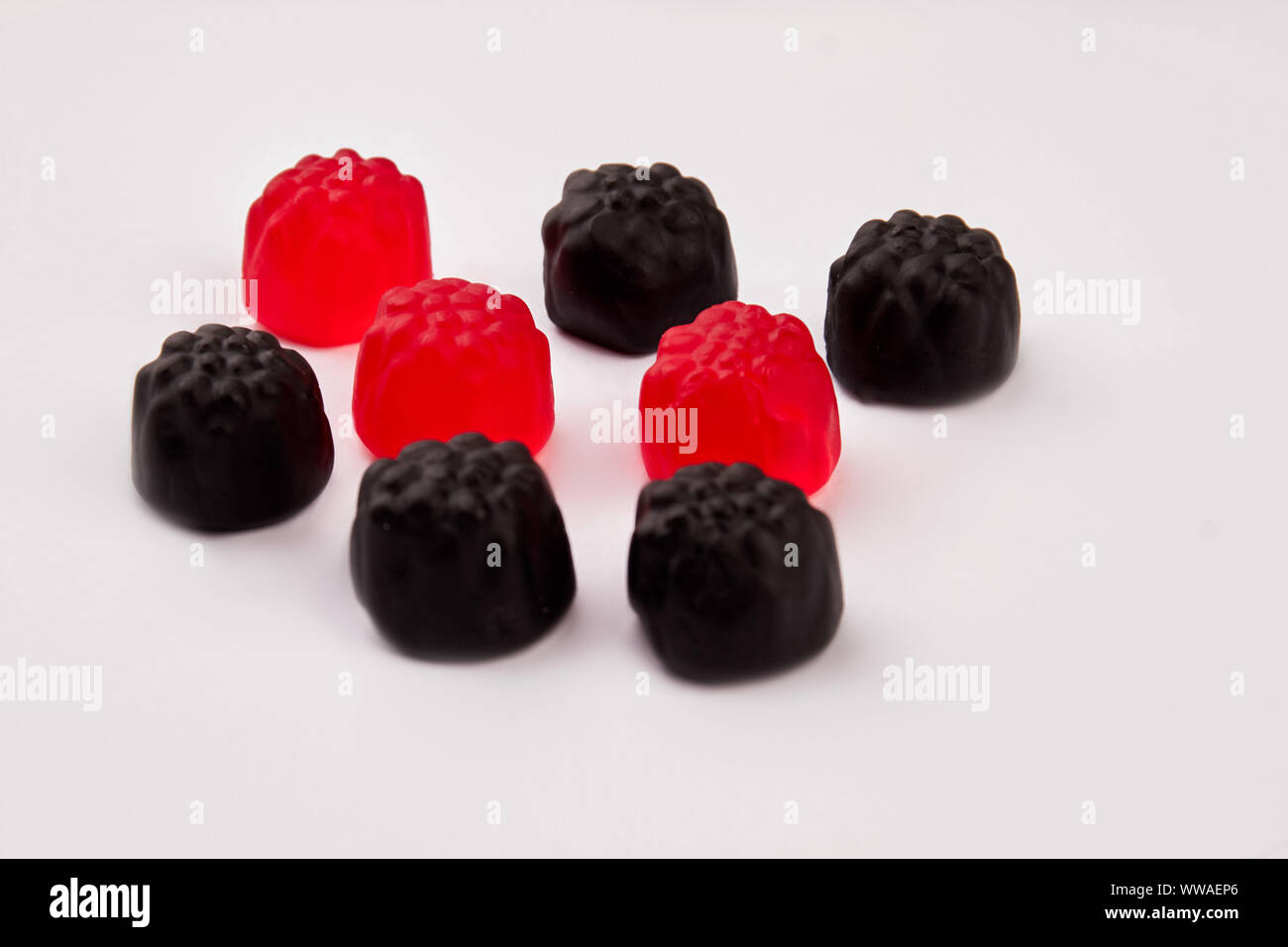 Black and red raspberries jelly sweets Stock Photo - Alamy
