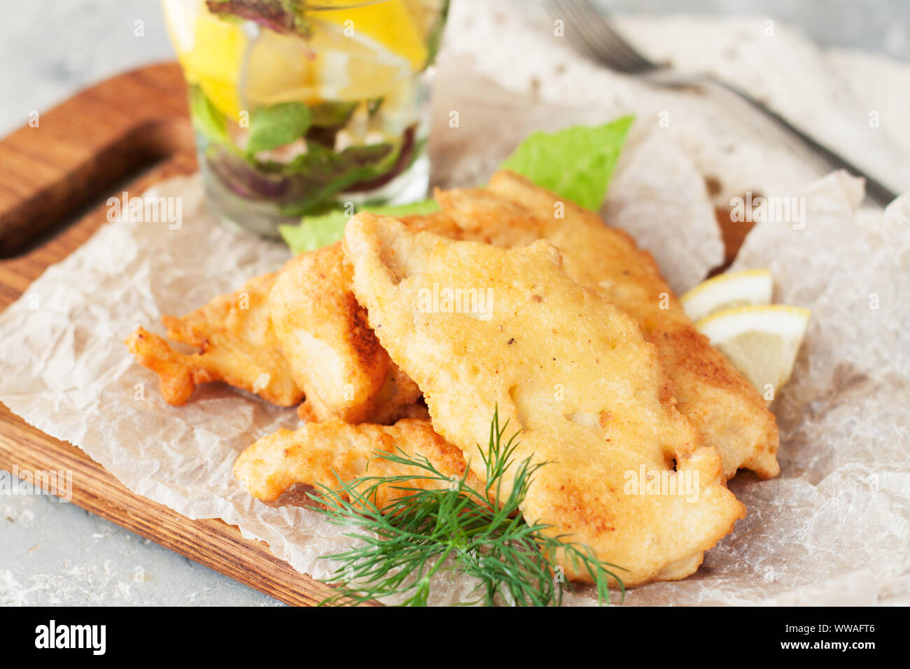 Fish dish - Cod in batter with lemon slices for a healthy and ...