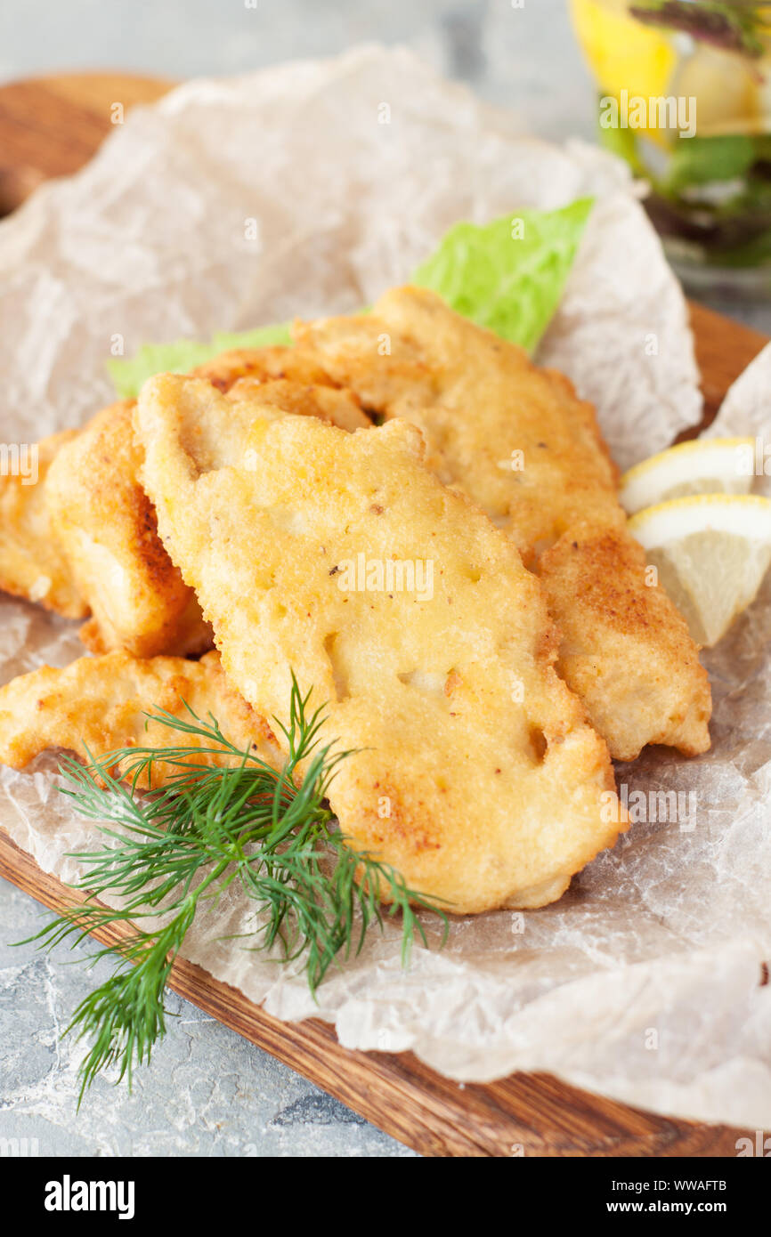 Fish dish - Cod in batter with lemon slices for a healthy and ...