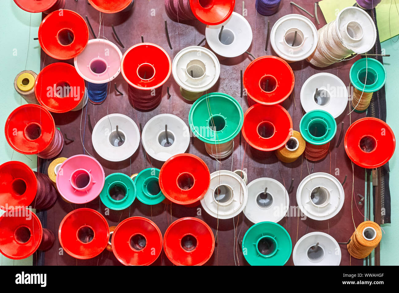 Spools thread in hand hi-res stock photography and images - Alamy