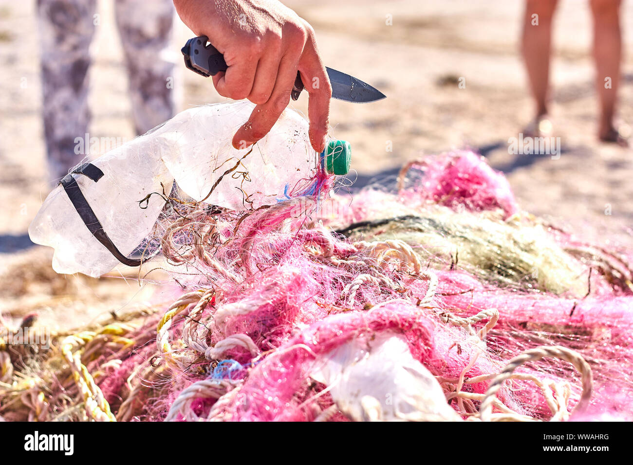 A tangled mess of fishing nets plastic rope and other debris washed up ...