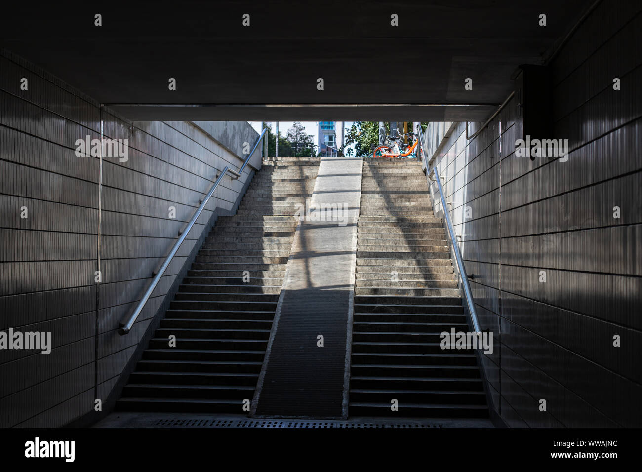 Empty underground pedestrian crossing. The tunnel and the day light at ...