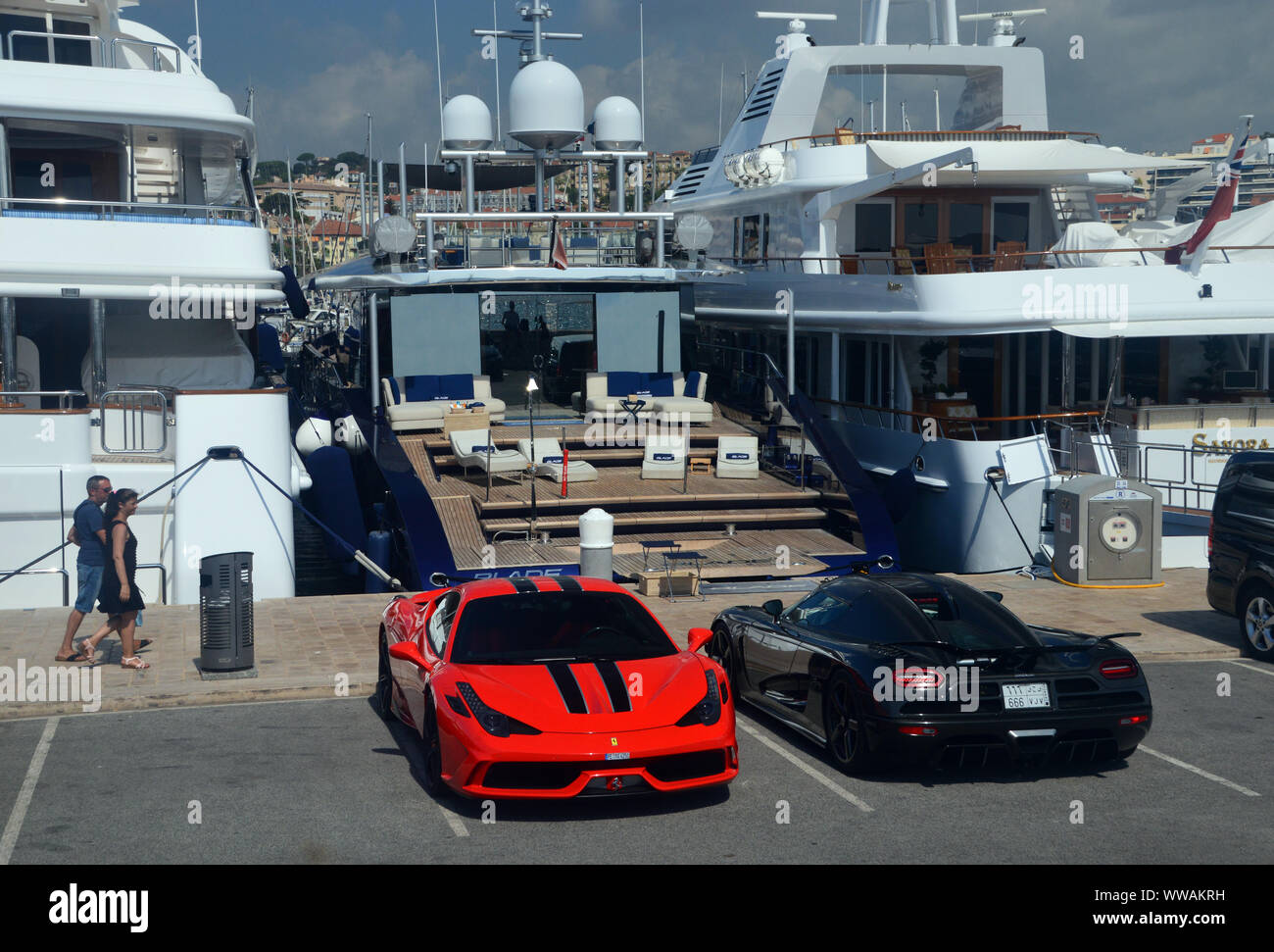 Sports Cars Parked by Luxury Yacht on the Jetty in the Harbour in ...