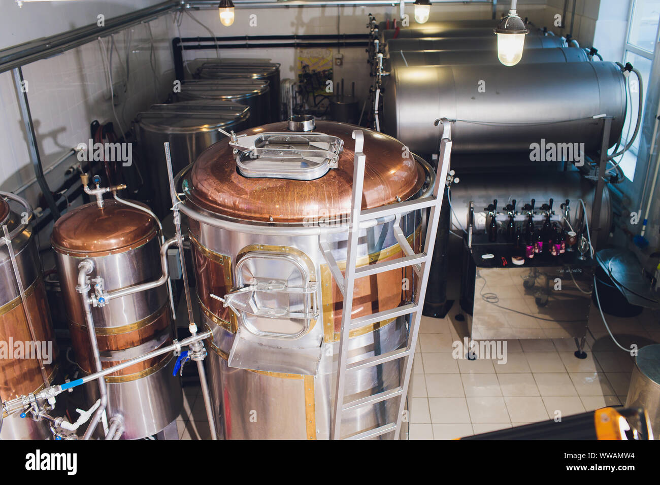 Craft beer brewing equipment in brewery Metal tanks, alcoholic drink ...