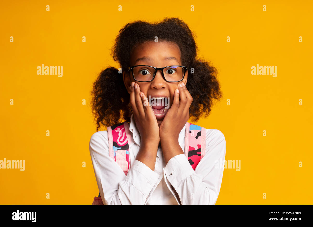 Scared Elementary Student Girl Screaming Looking At Camera, Studio Shot ...