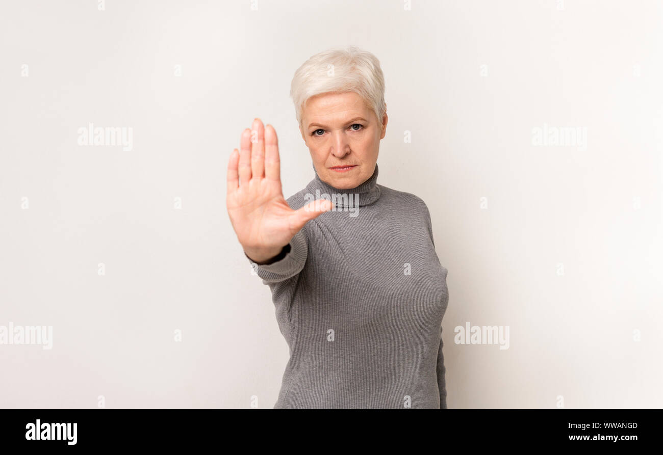Stop sign woman senior hi-res stock photography and images - Alamy