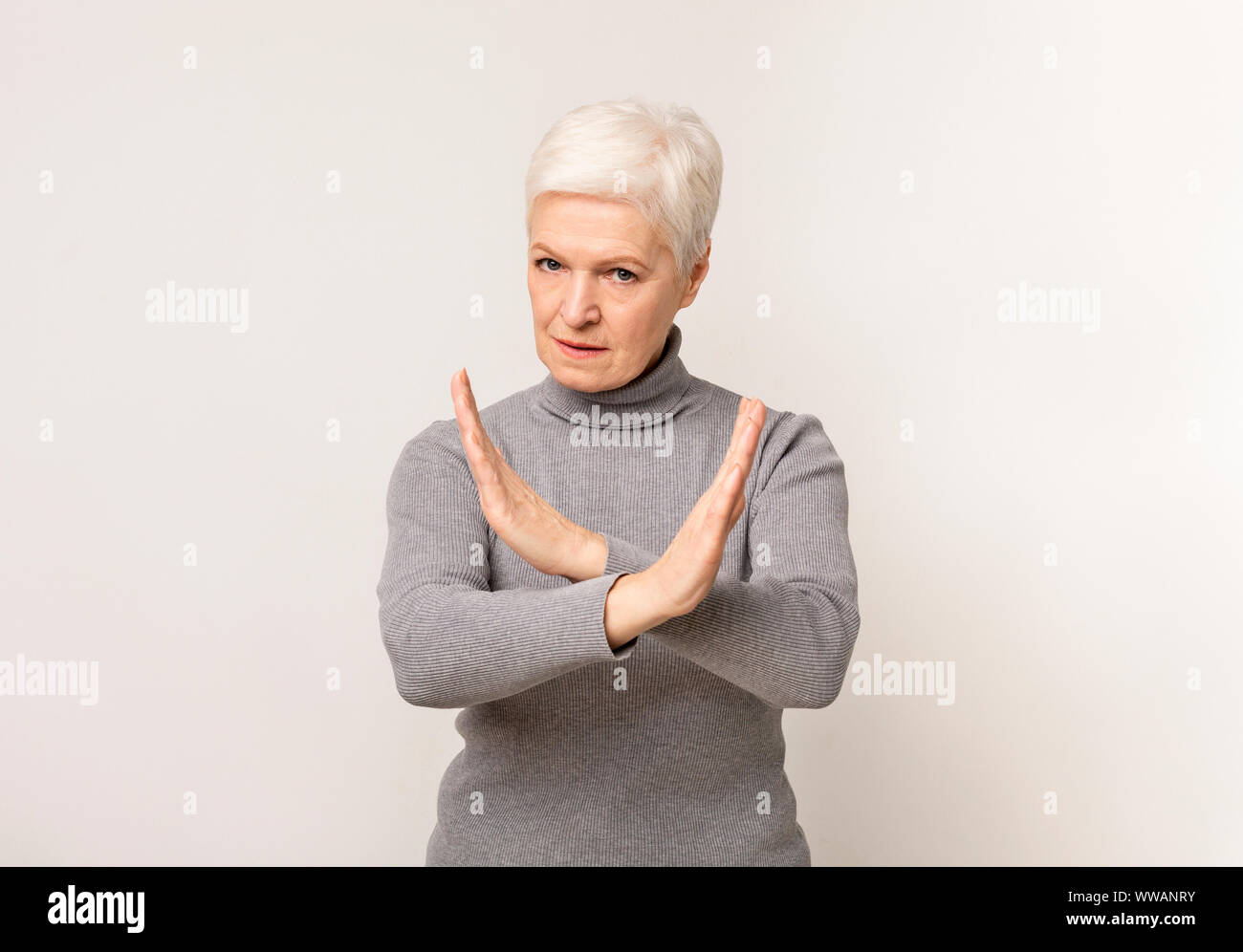 Stop sign woman senior hi-res stock photography and images - Alamy