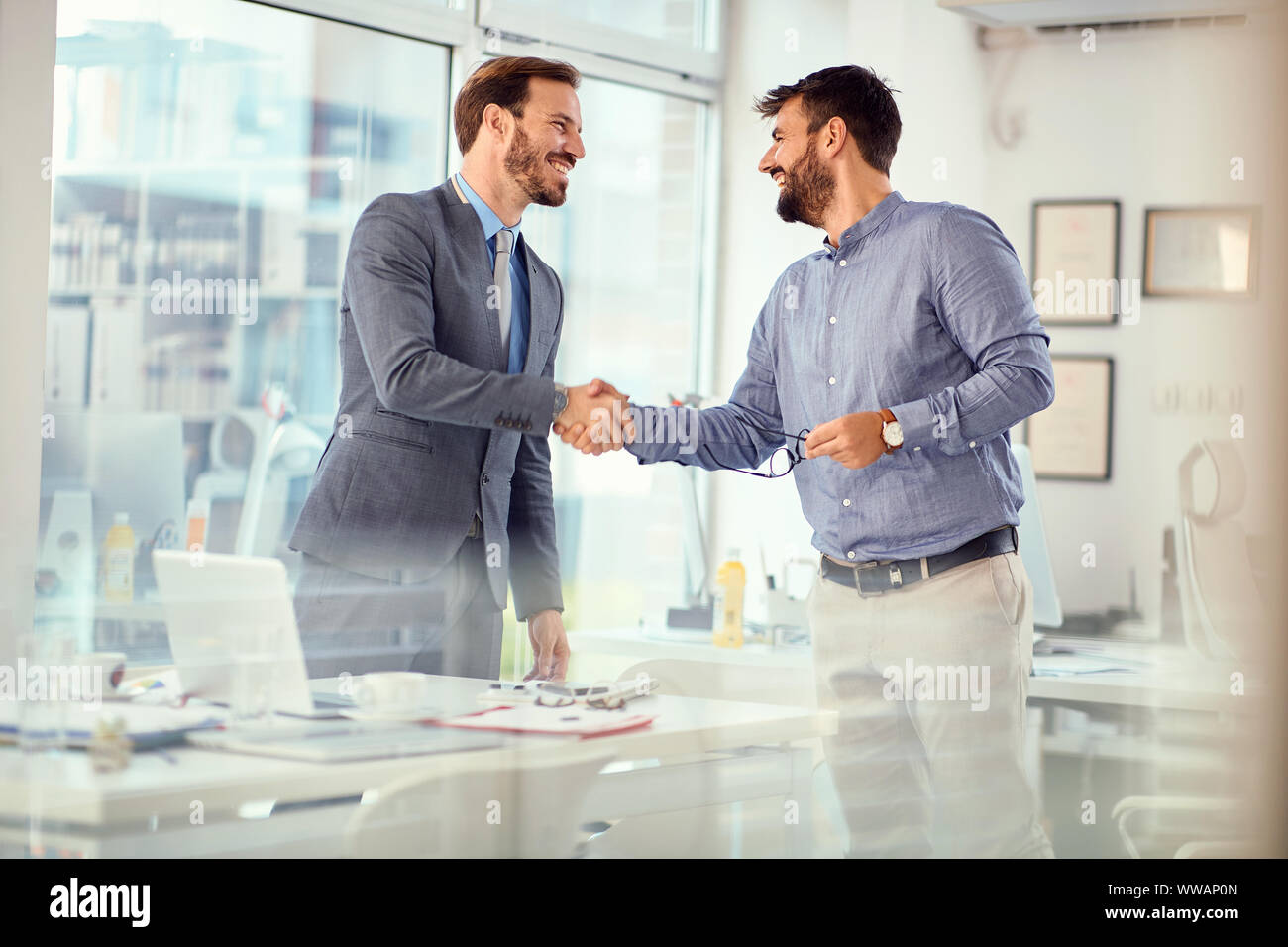 businessman successfully completed business meeting with smiling ...