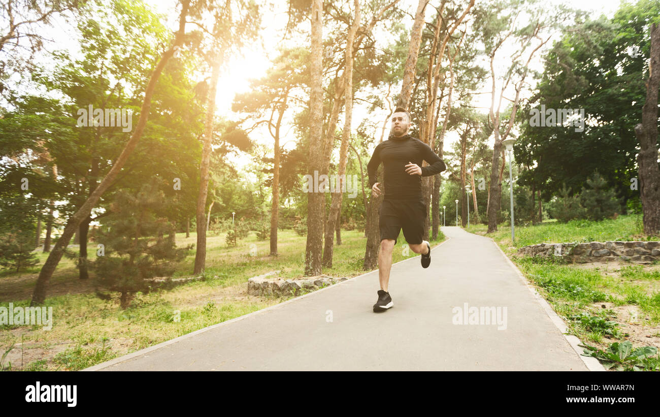 Jogger on path in park hi-res stock photography and images - Alamy