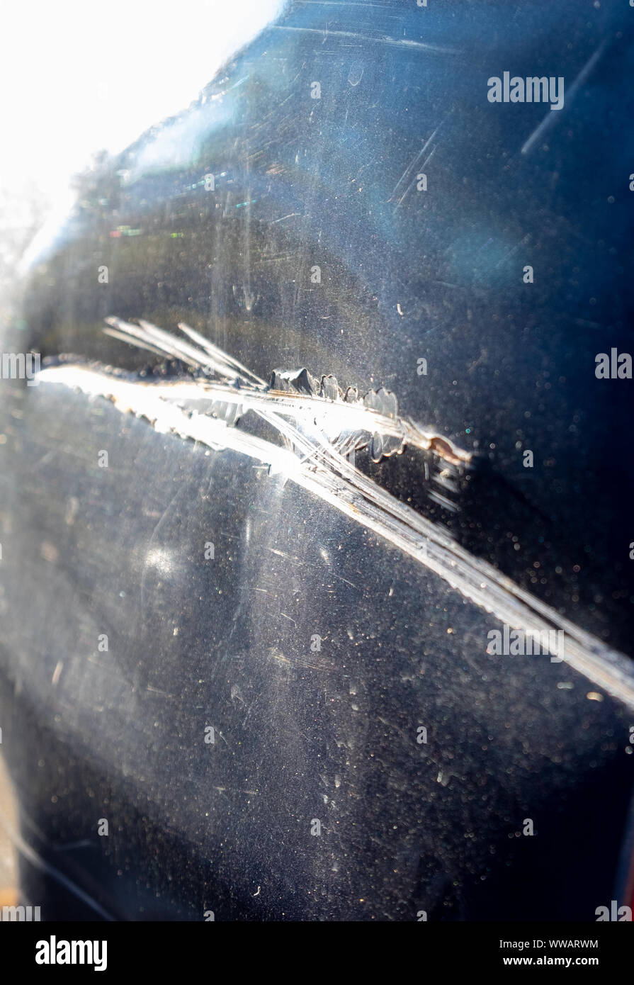 Blue or black car get scratch damaged from accident on the road. White ...