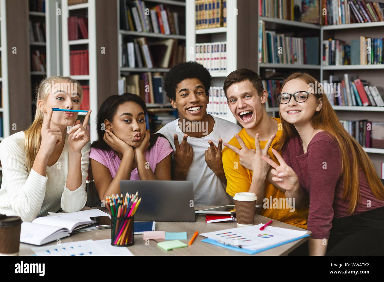 Group of international students having fun while studying Stock Photo ...