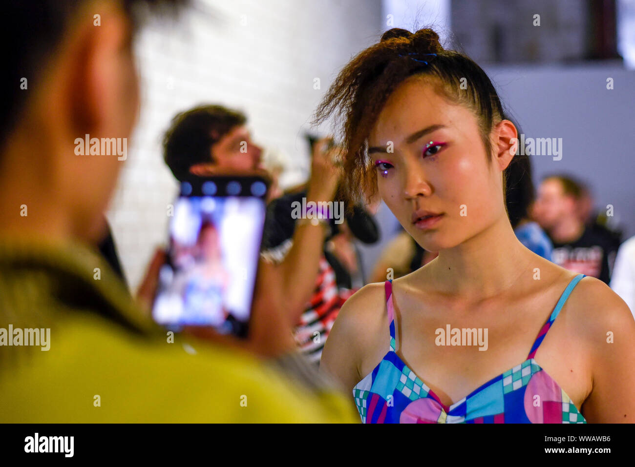 London, UK. 14 September 2019. A model backstage ahead of the Simon Mo ...