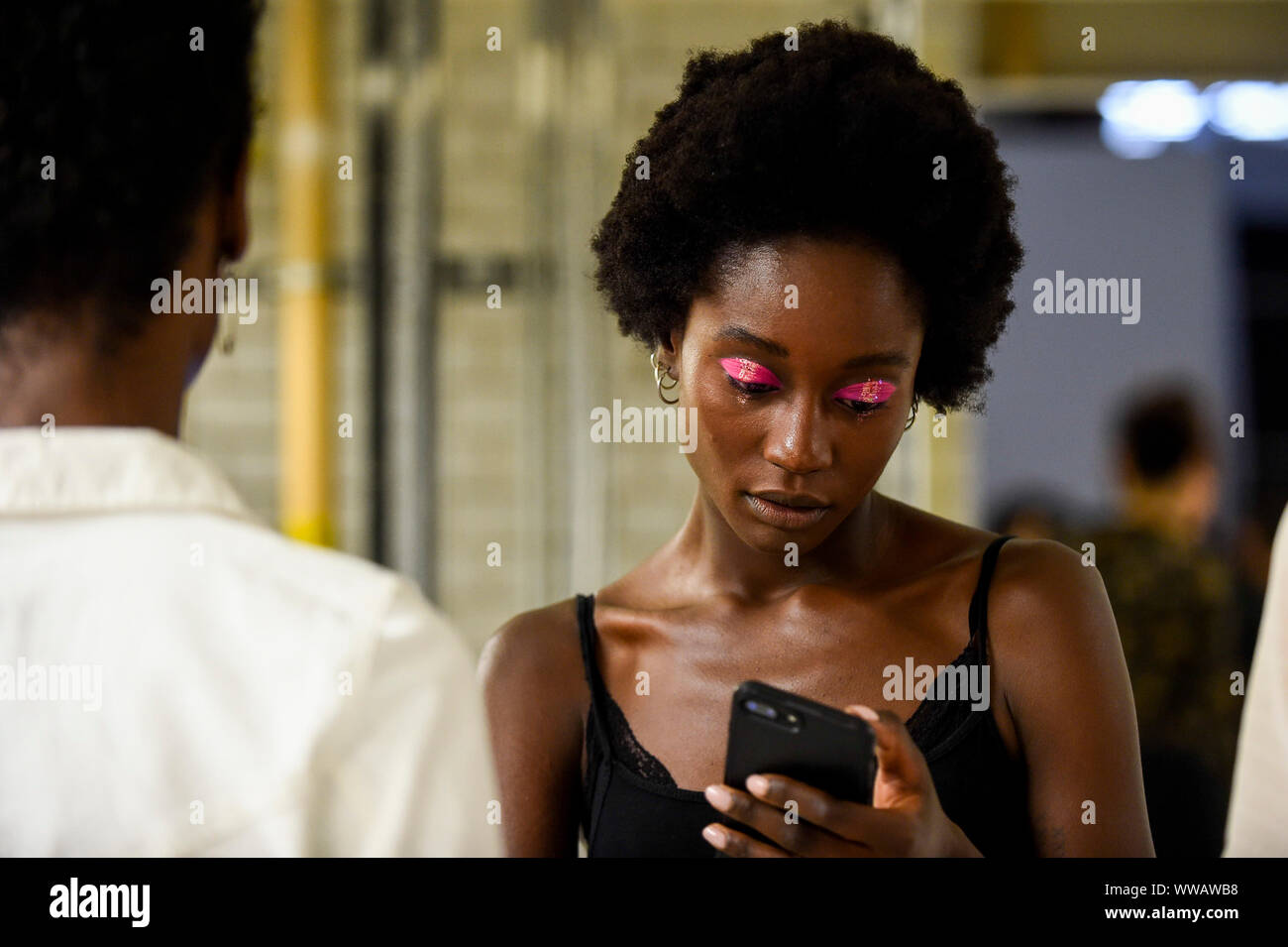 London, UK. 14 September 2019. A model backstage ahead of the Simon Mo ...